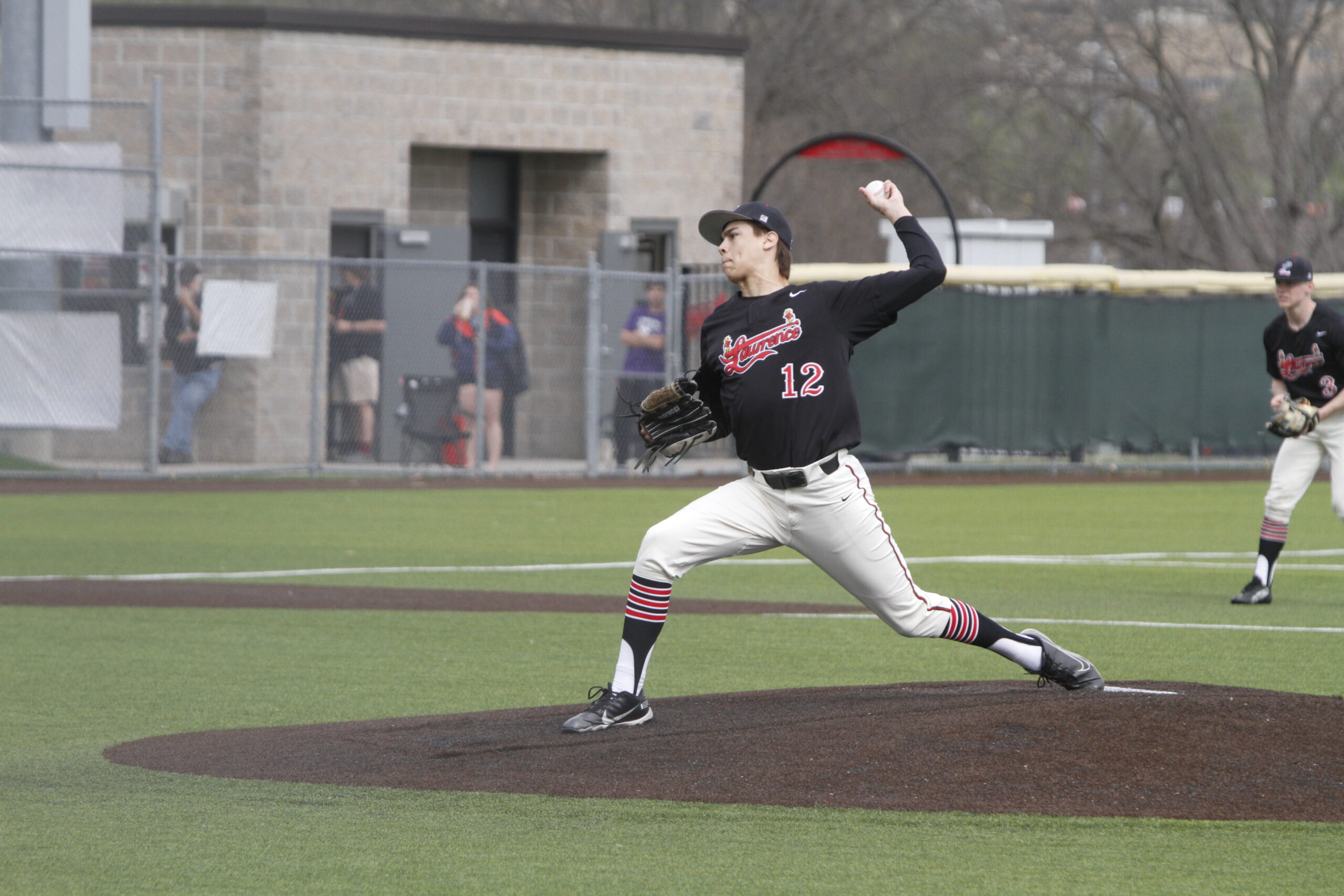 Lawrence senior pitches first varsity innings, secures a win for the ...